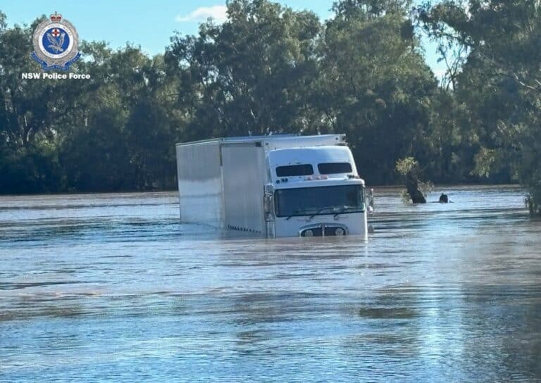 Truck driver caught in floodwaters being investigated for alleged ...