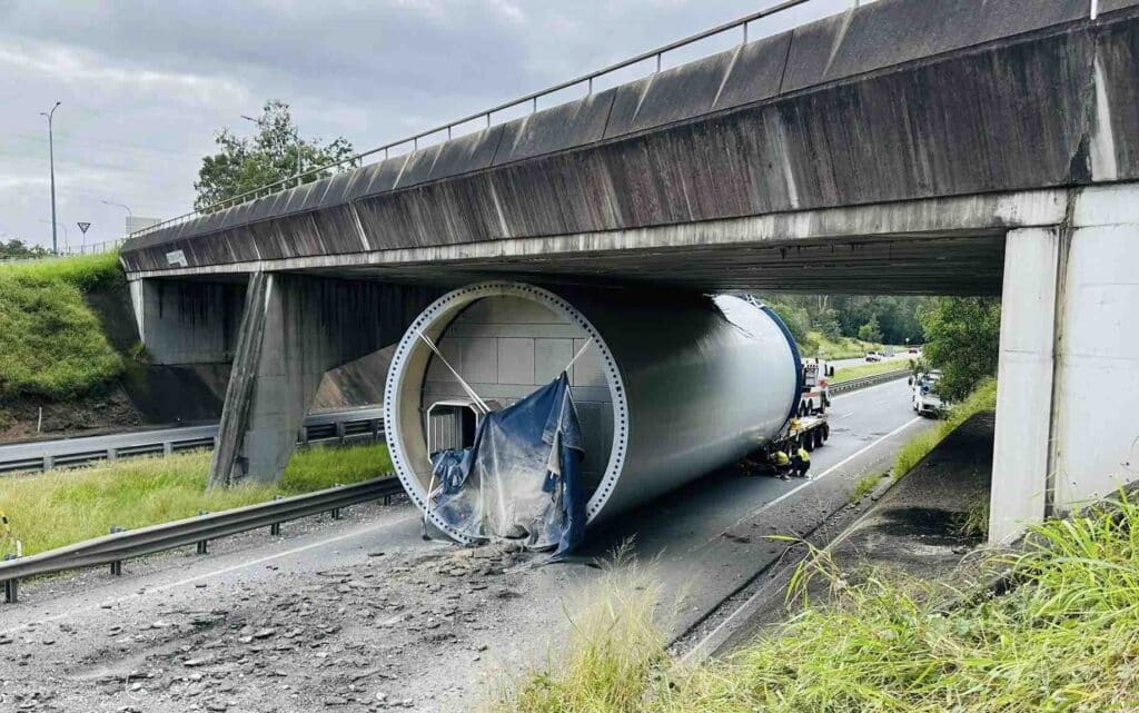Major highway closed as truck carrying section of wind turbine strikes ...